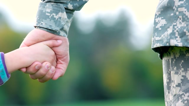 Soldier Carrying Child Stock Footage: Royalty-Free Video Clips ...