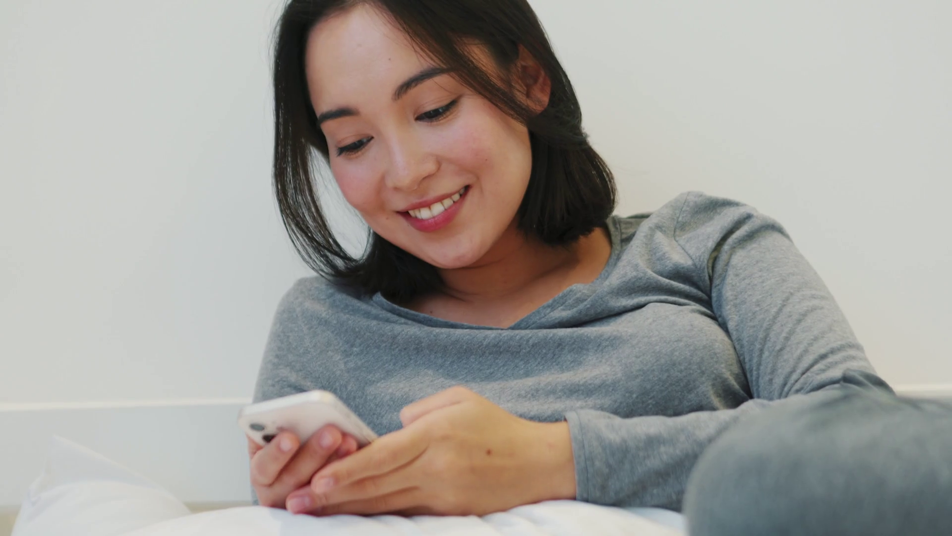 Laughing Asian Woman Texting Phone At Home Stock Footage SBV-352771225 ...