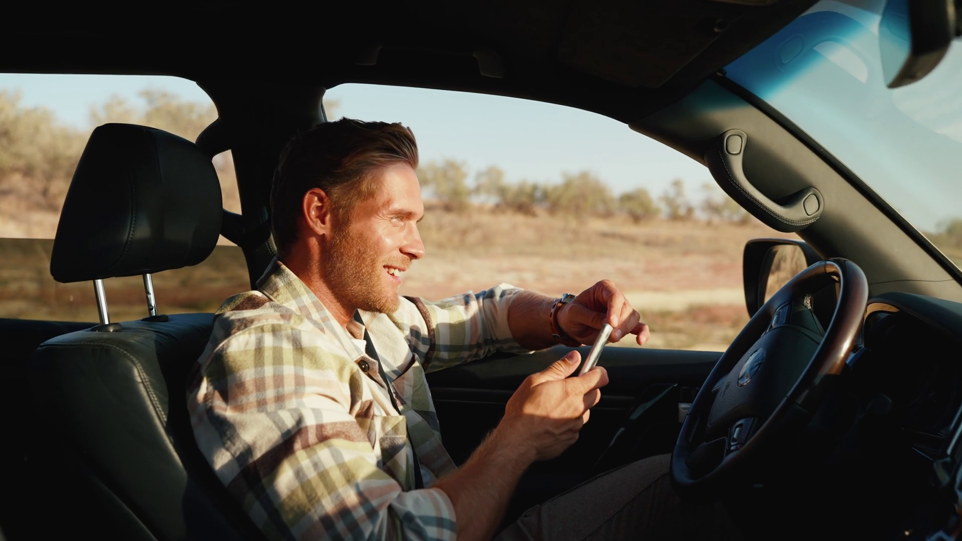 Sunny Man Texting On Phone Driving In Car In Stock Footage SBV-352454134 - Storyblocks