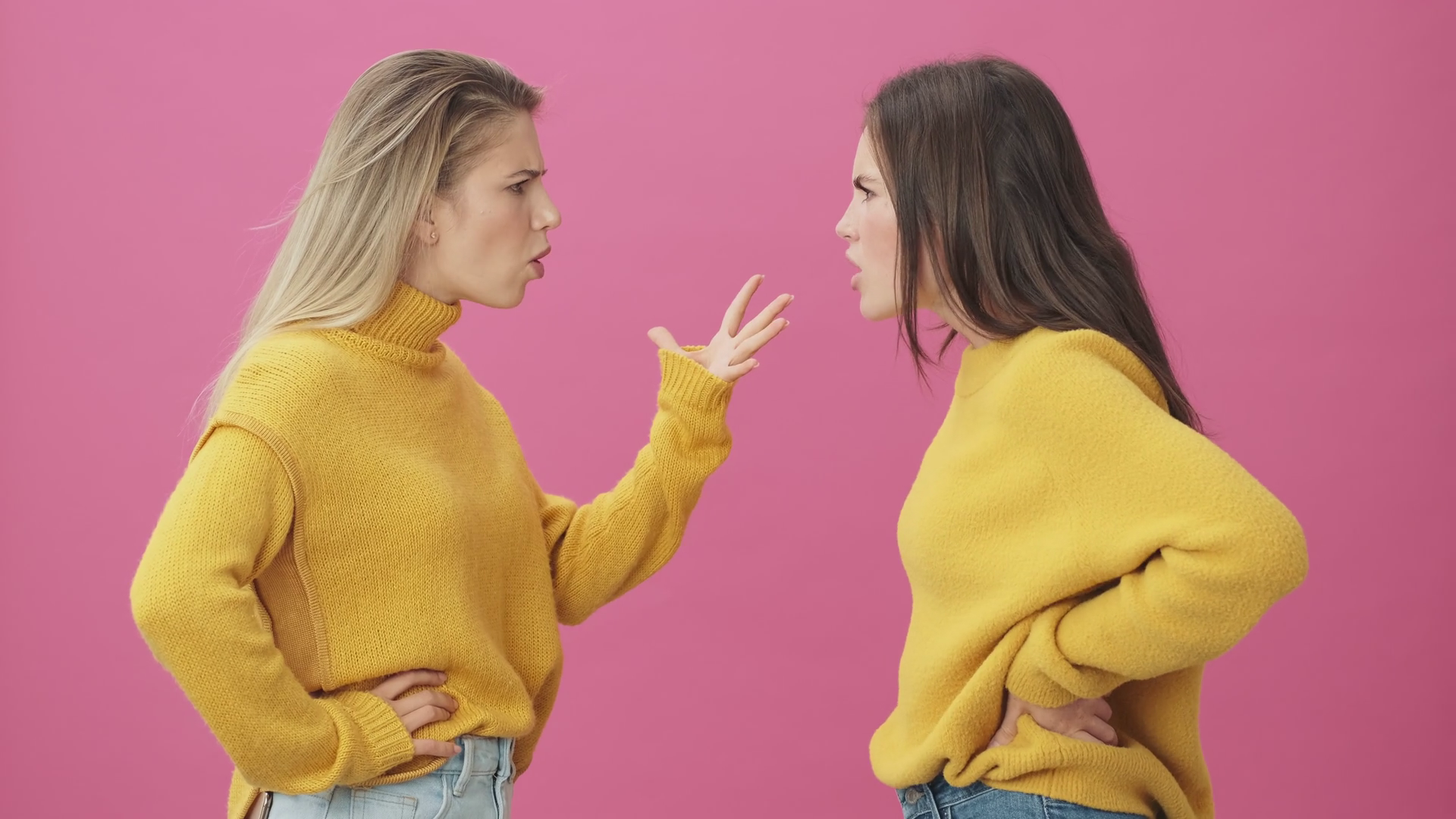 Two Angry Women Wearing Yellow Sweaters Are Stock Footage SBV-352681018 ...