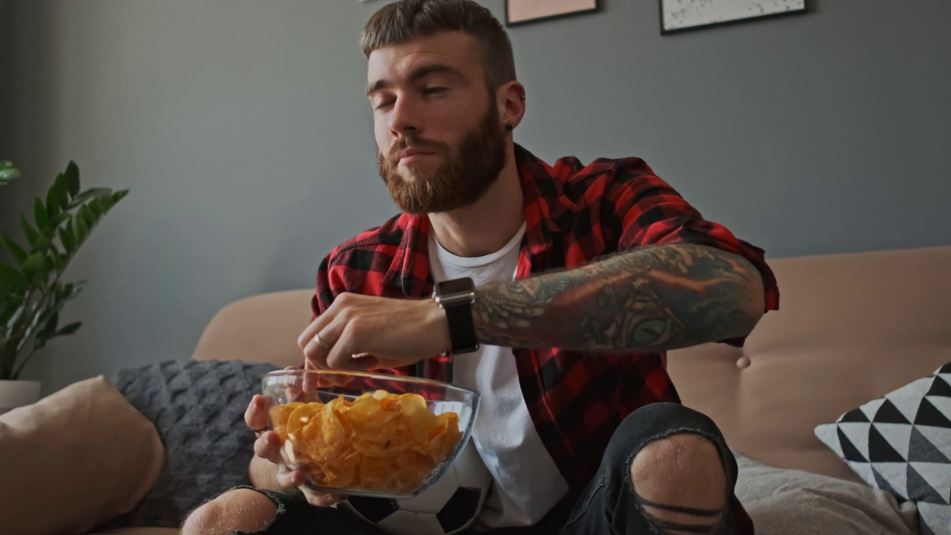 Concentrated Bearded Male Fan Eating Chips Stock Footage SBV-352650520 ...