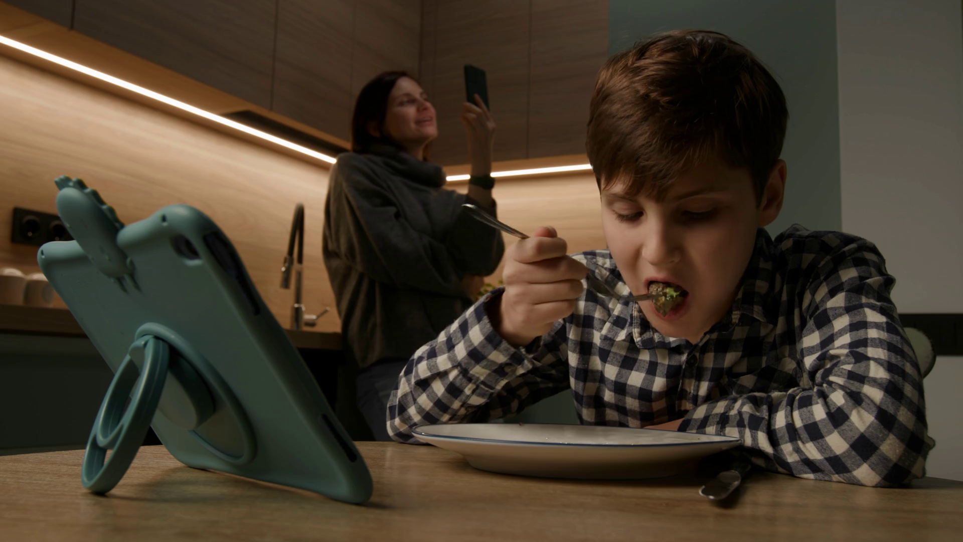 Boy Eating In Kitchen Watching Tablet With Stock Footage SBV-351669158 ...