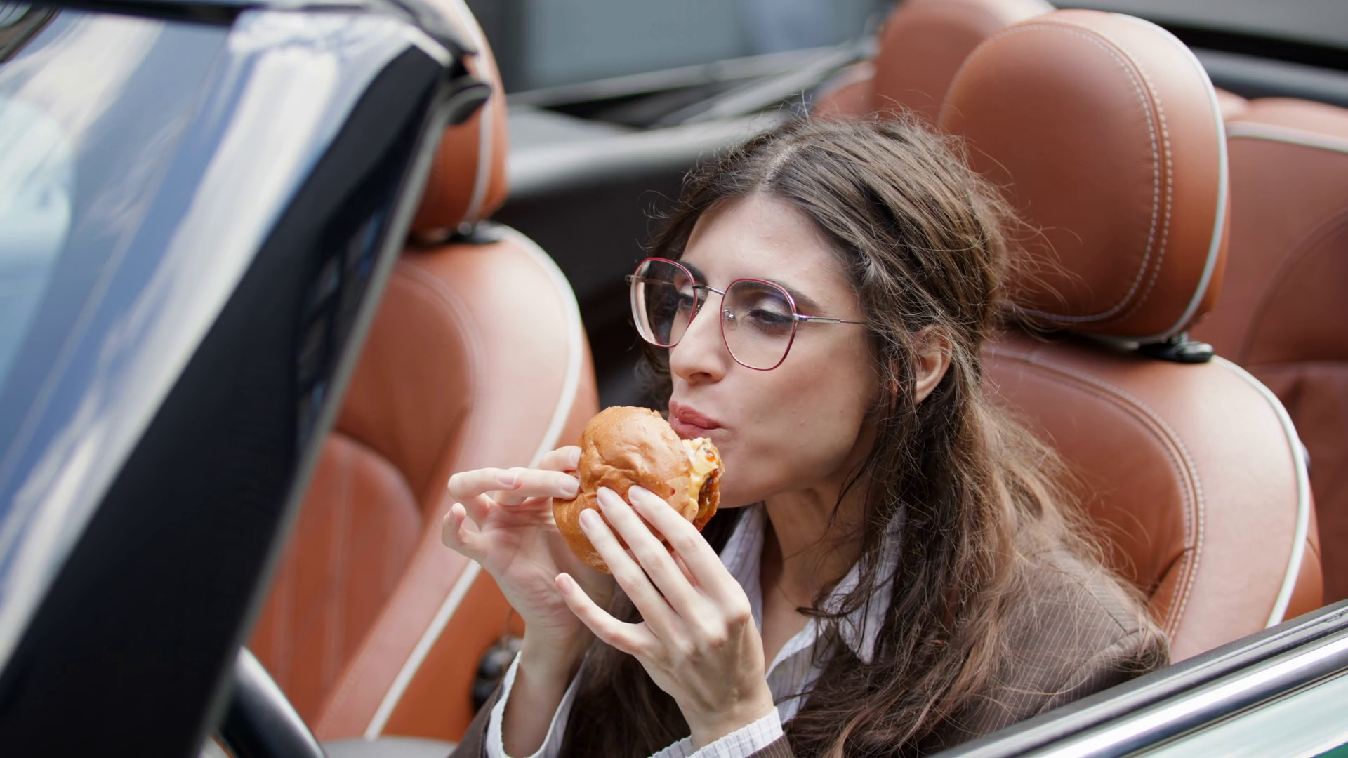 Female Driver Eating Burger Sitting In Car Stock Footage SBV-348617141 ...