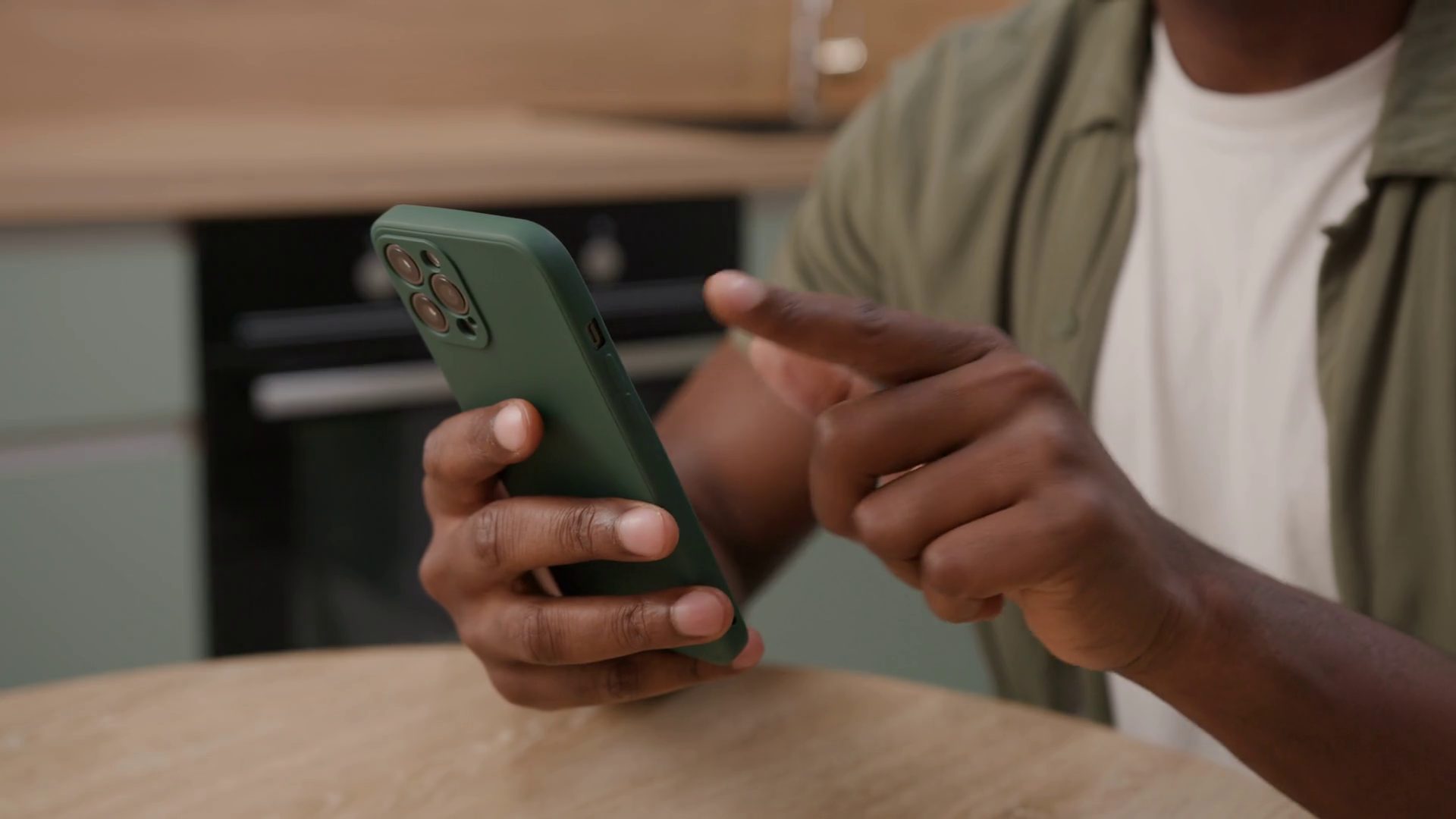 Black Hands Scrolling Cellphone In Green Case Stock Footage SBV-348821282 - Storyblocks