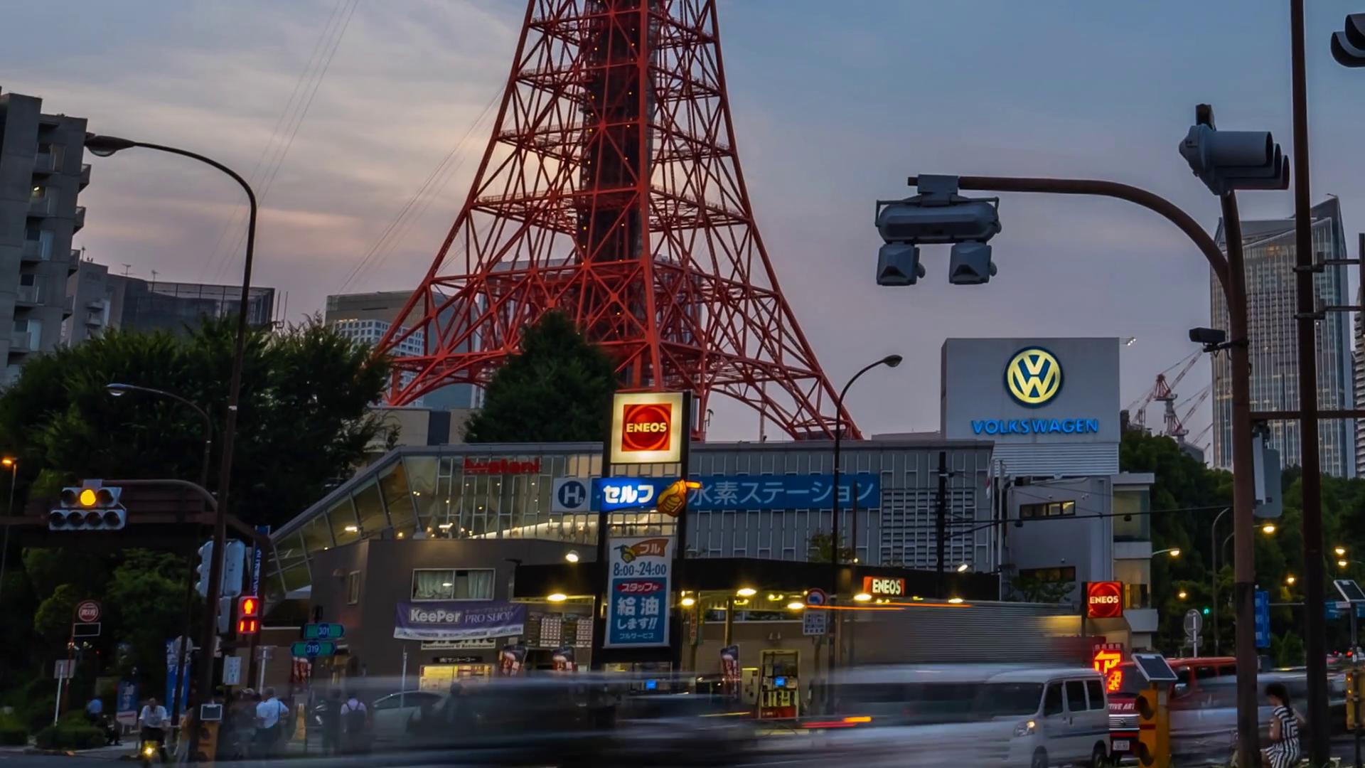 Zoom out time lapse of vehicles moving on Tokyo street at dusk, Japan ...