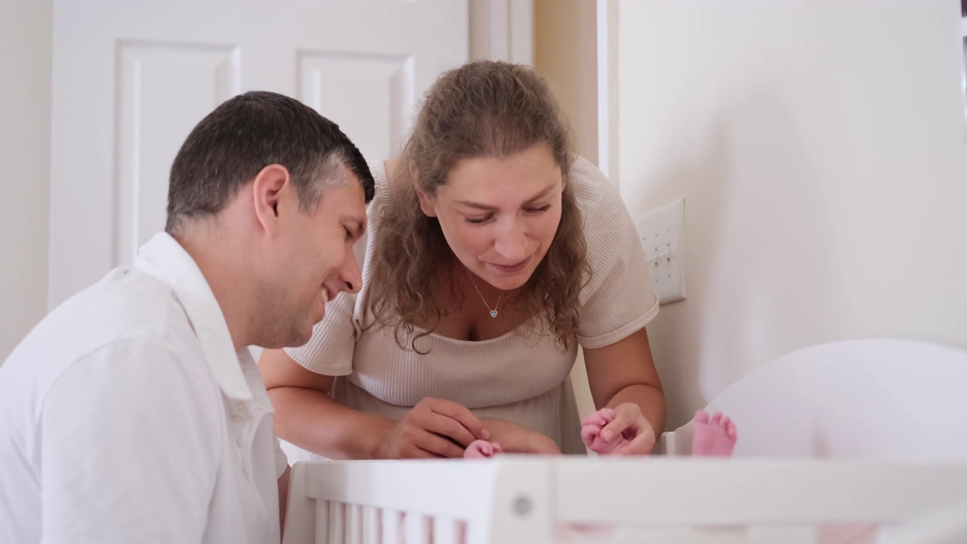 Loving Couple Admiring Baby In Crib Stock Footage SBV-352525722 ...