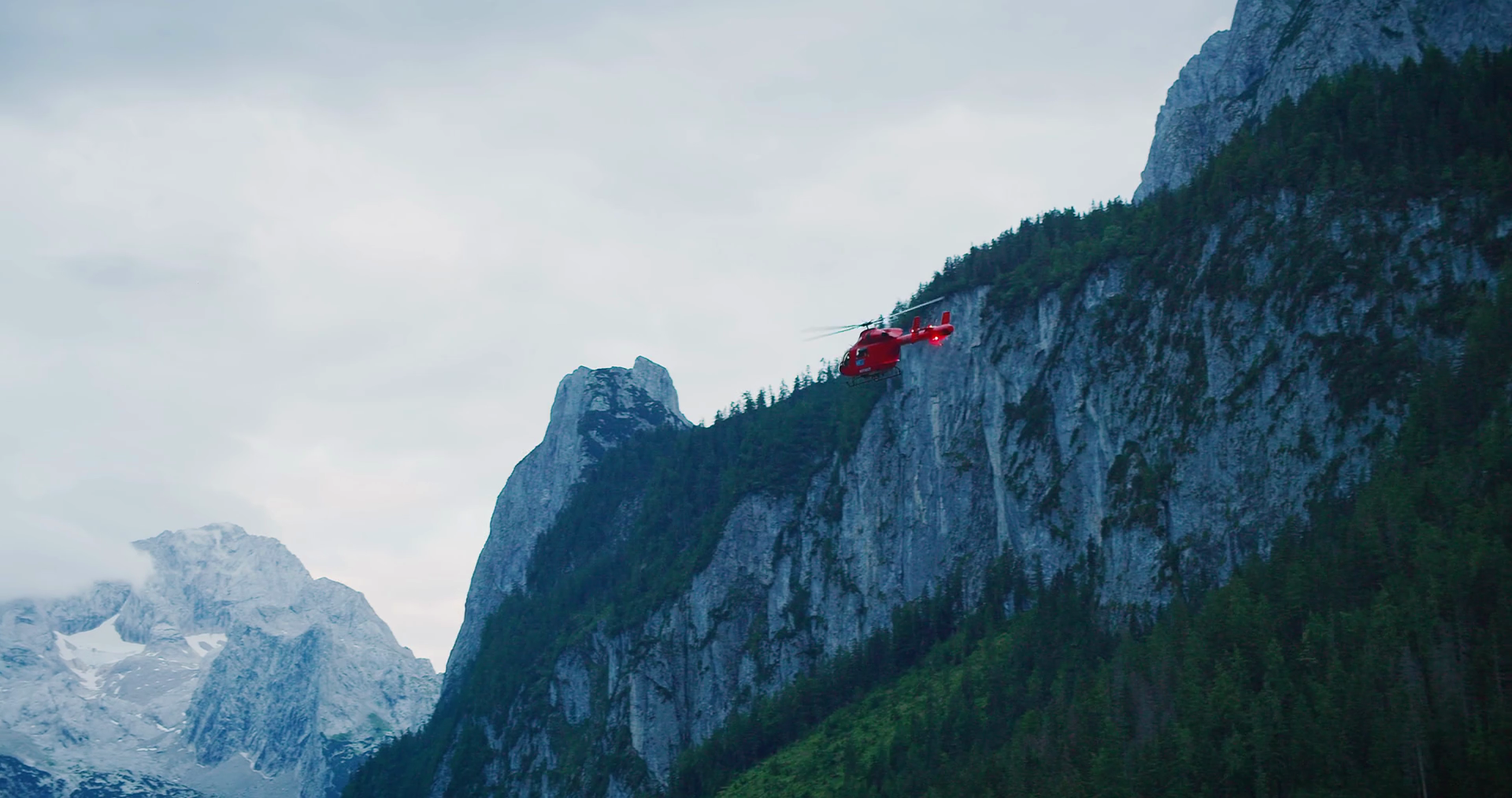 Red Rescue Helicopter Flying Over Lush Green Stock Footage SBV ...