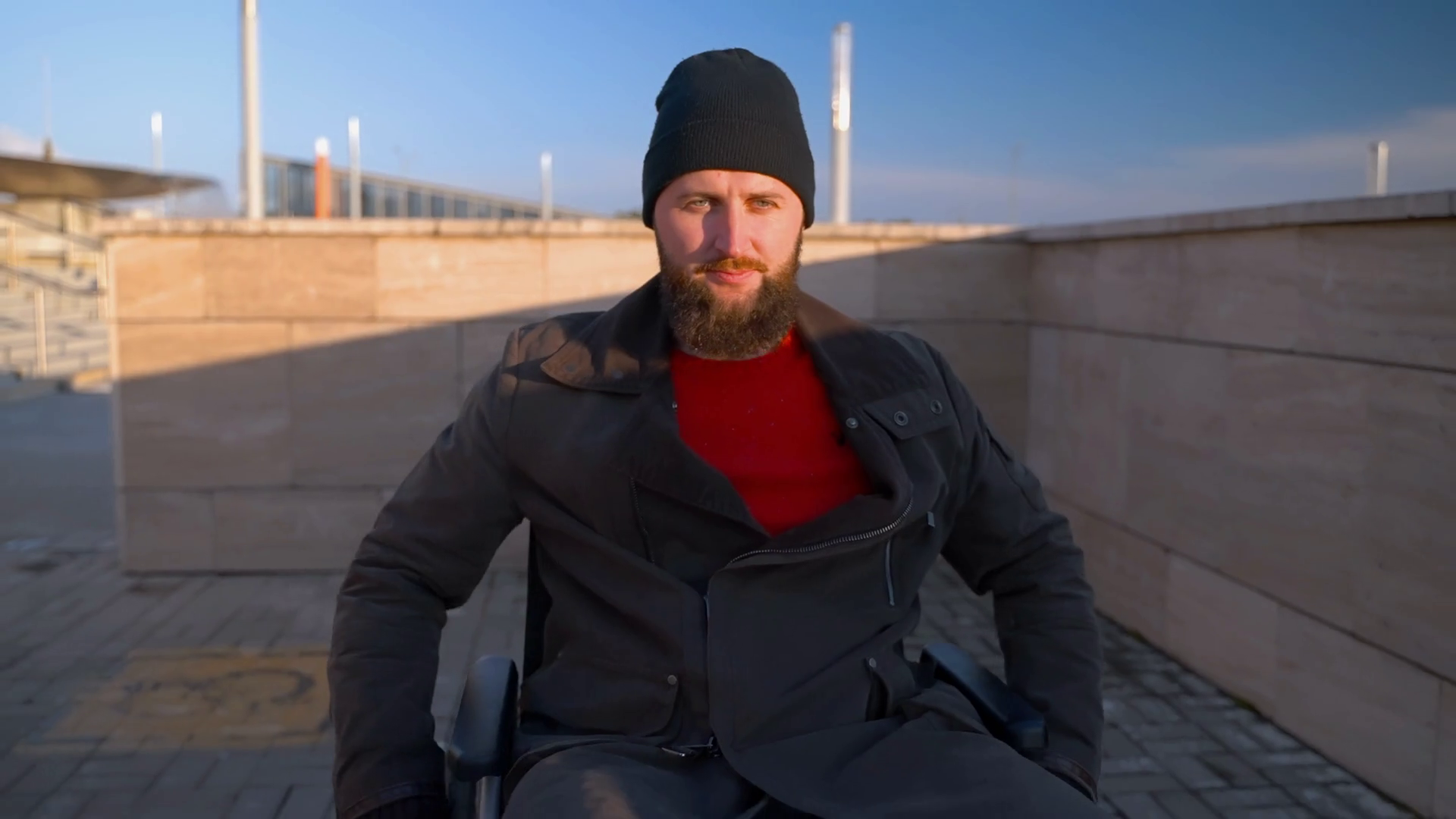 Slow motion shot of a joyful disabled man having fun and spreading ...