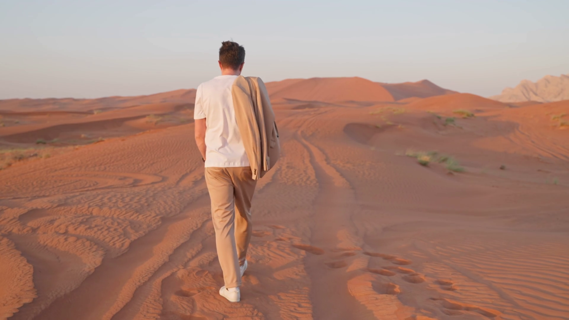 Follow Shot Of Young Man Walking Over Sand Stock Footage SBV-348822531 ...
