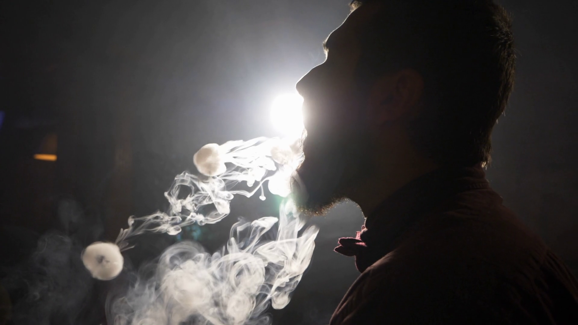 Handsome young guy smoking hookah and makes rings of smoke. Stock Video ...