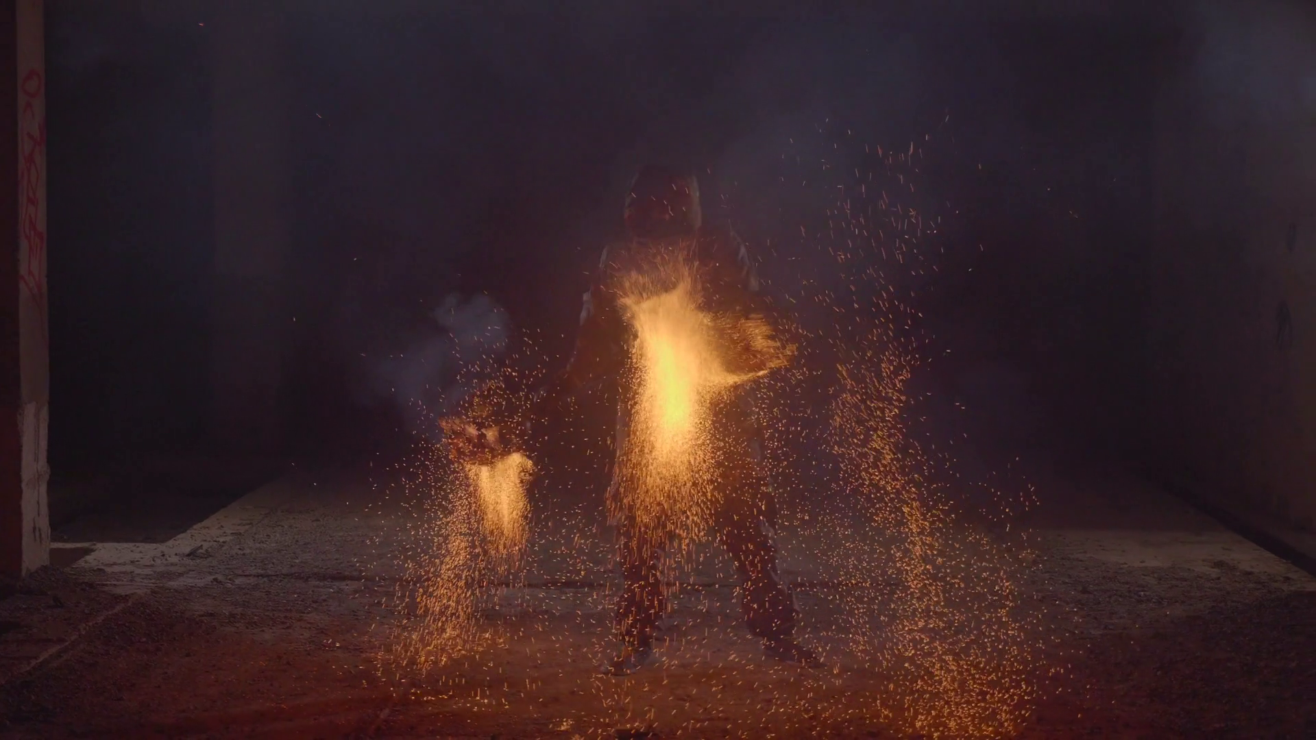 Sparks from fireshow, man making fire show with a lot of sparks at dark ...