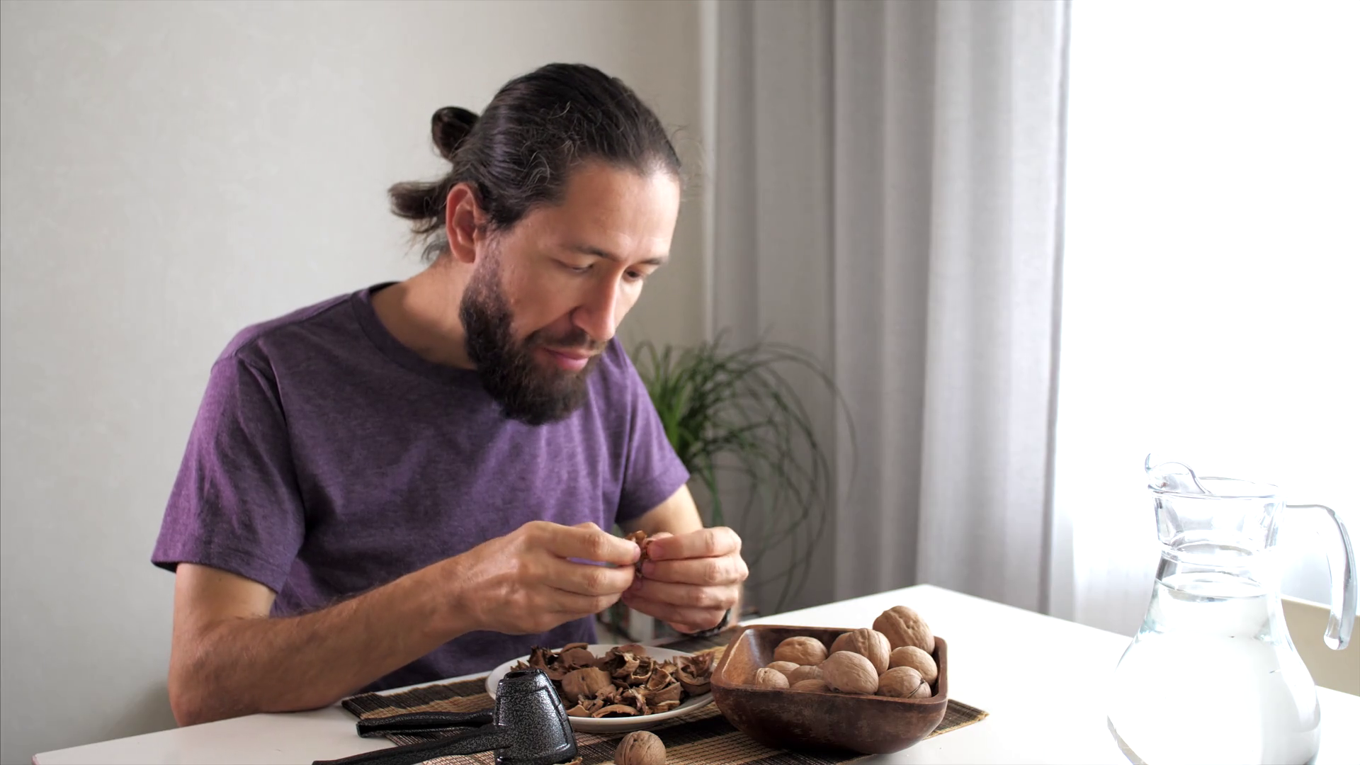 Bearded Man Cracking Eating Walnuts At Home Stock Footage SBV-338831107 ...