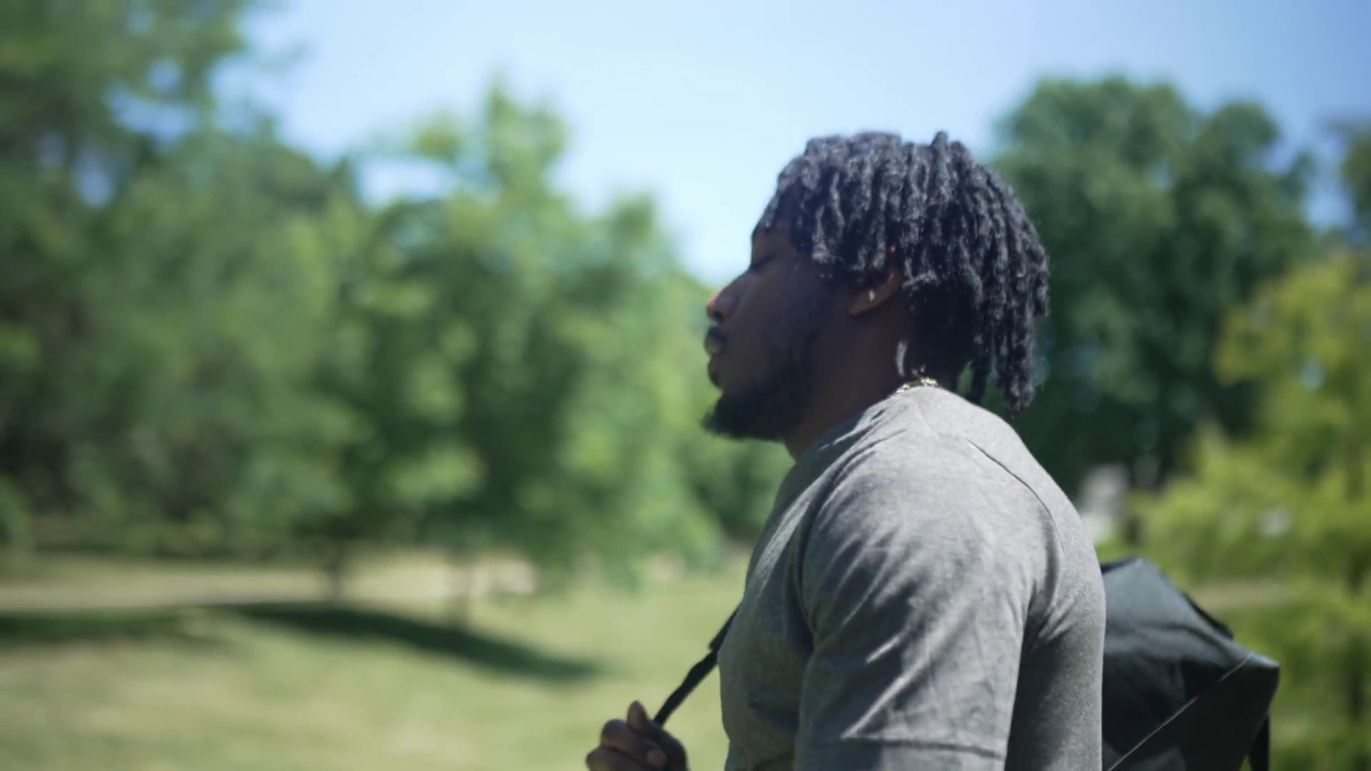 Black man exhausted from work out walking though the park Stock Video ...