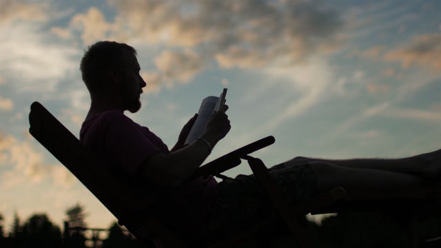 Reading Book Sunset Stock Footage: Royalty-Free Video Clips - Storyblocks