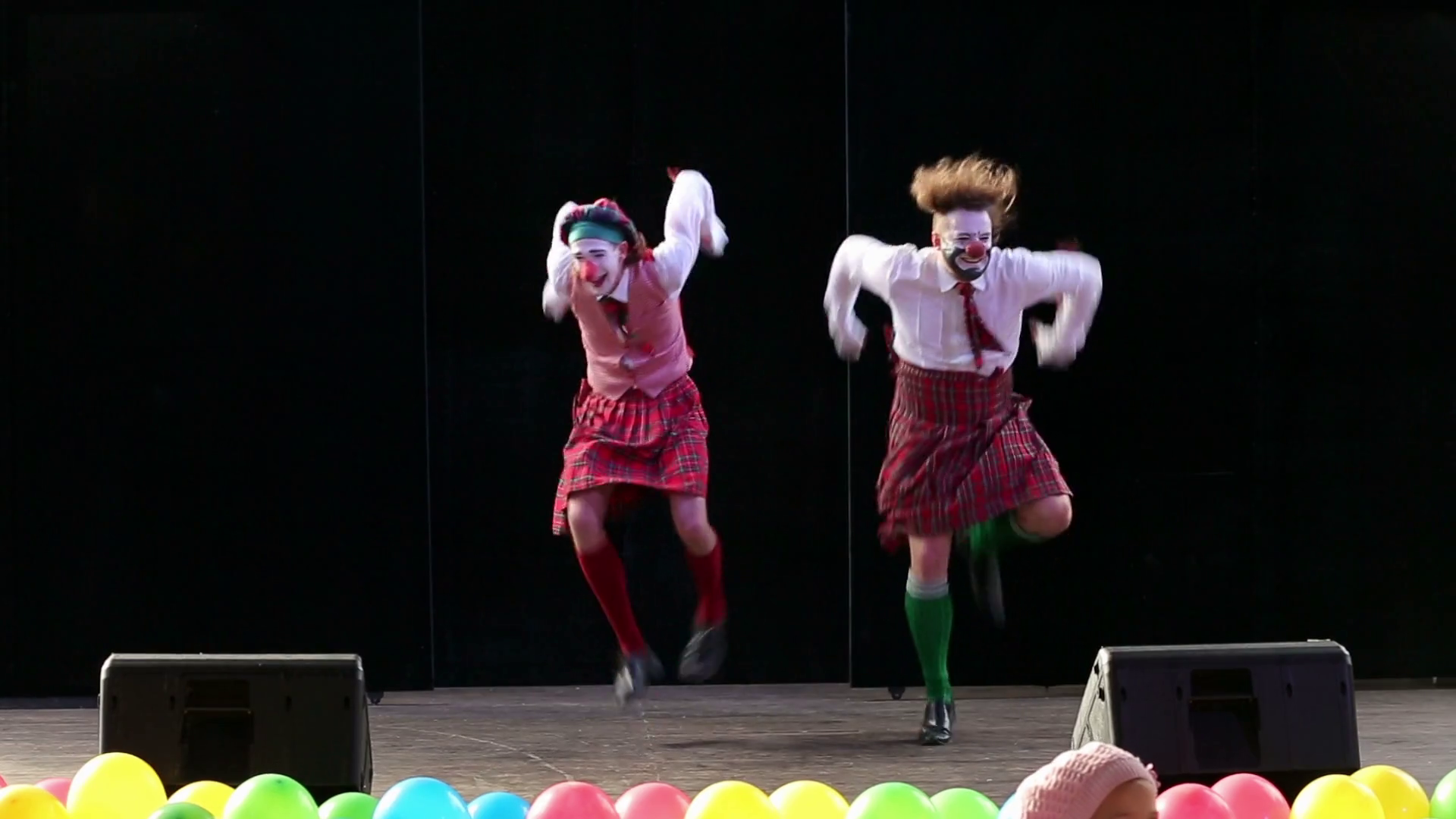 MOSCOW, RUSSIA - SEPTEMBER 12, 2015: Clowns in Scottish kilts dancing ...