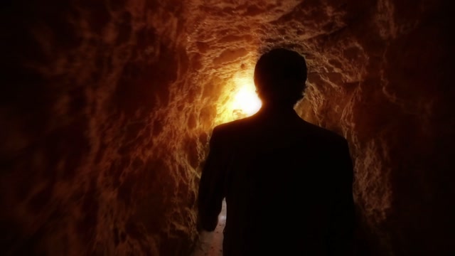 Guy Walking From Dark Tunnel To The Light Stock Footage: Royalty-Free Video Clips - Storyblocks