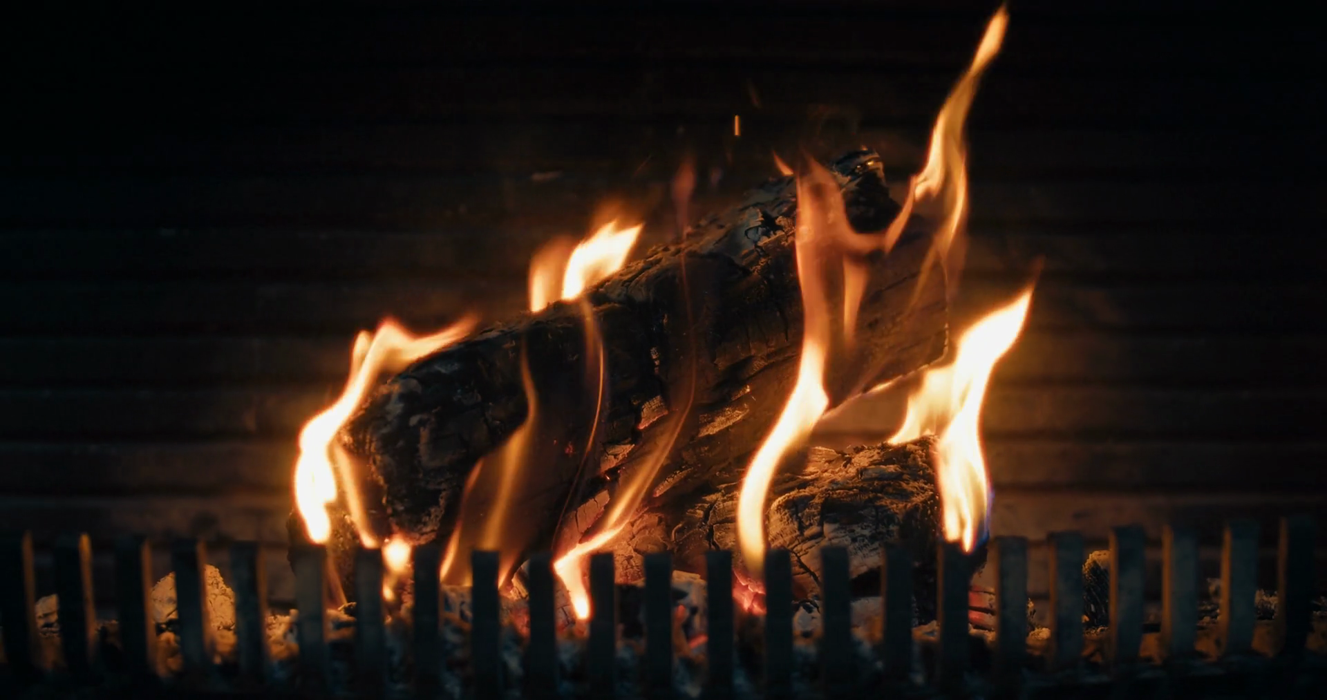 Burning firewood in house fireplace heating home in slow motion on ...