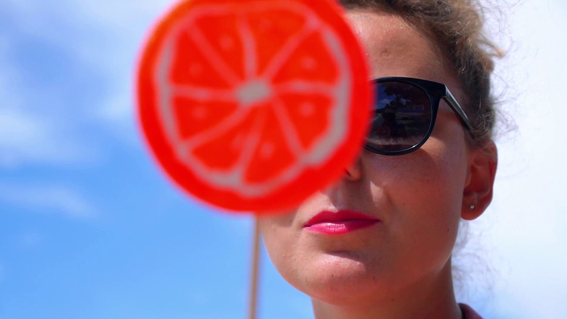 Portrait Of Woman Licking Lollipop Outdoors Stock Footage SBV-304586463 - Storyblocks