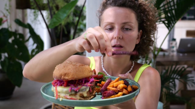 Woman Enjoying Meal Stock Footage: Royalty-Free Video Clips - Storyblocks