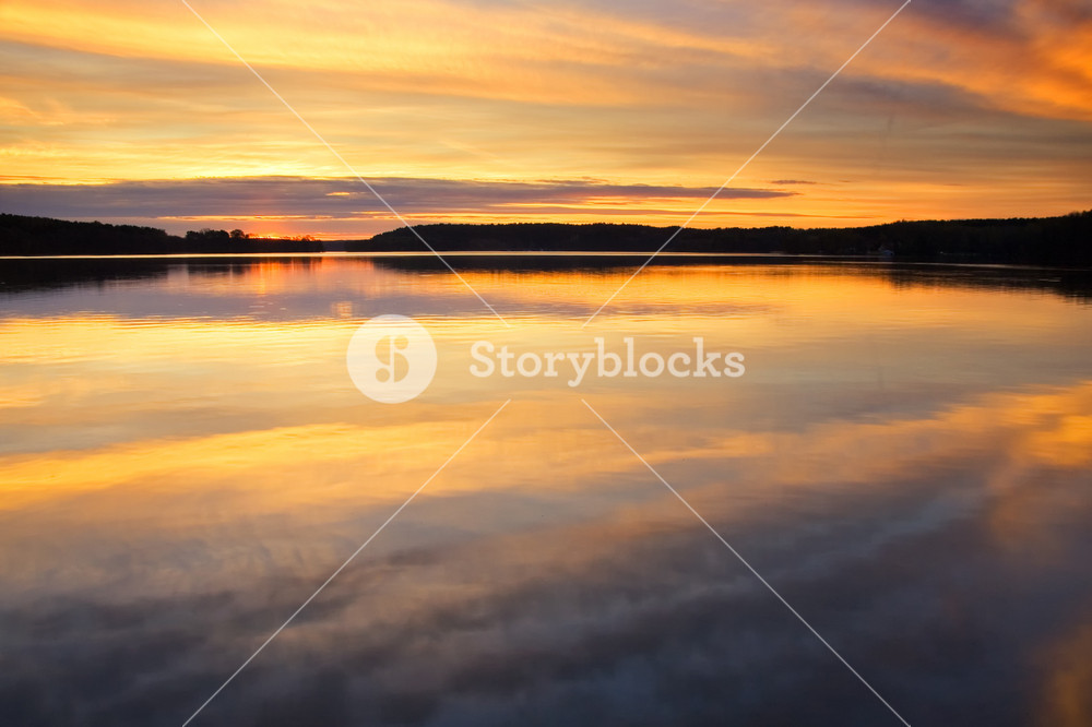 Beautiful calm lake with reflections in water photographed in sunset ...