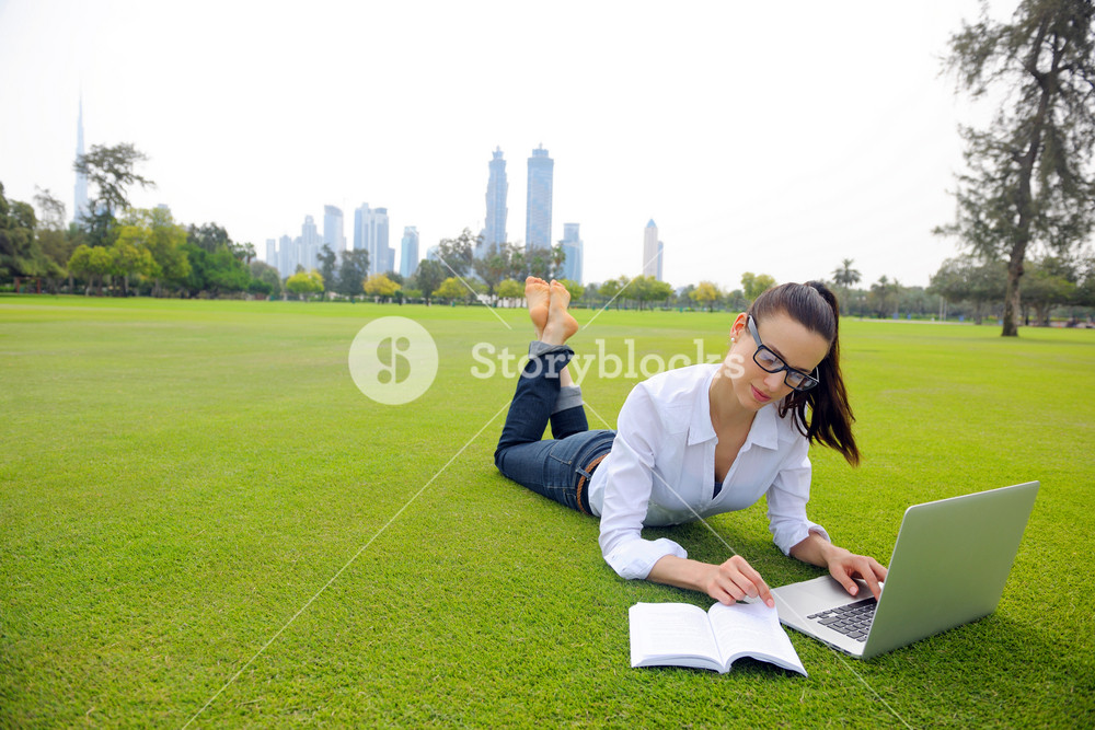 Woman With Laptop In Park Royalty-Free Stock Image - Storyblocks