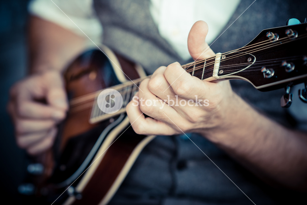close up hands hipster man playing mandolin in the city Royalty-Free ...