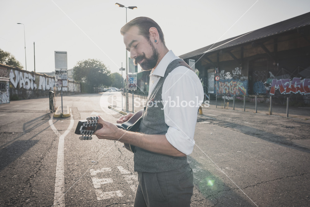 Stylish man playing mandolin in the city Royalty-Free Stock Image ...