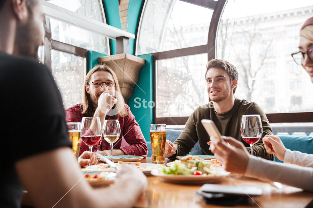People Eating At Cafe