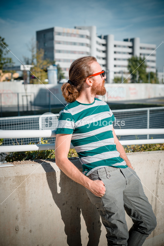 stylish hipster model with long red hair and beard lifestyle in the ...