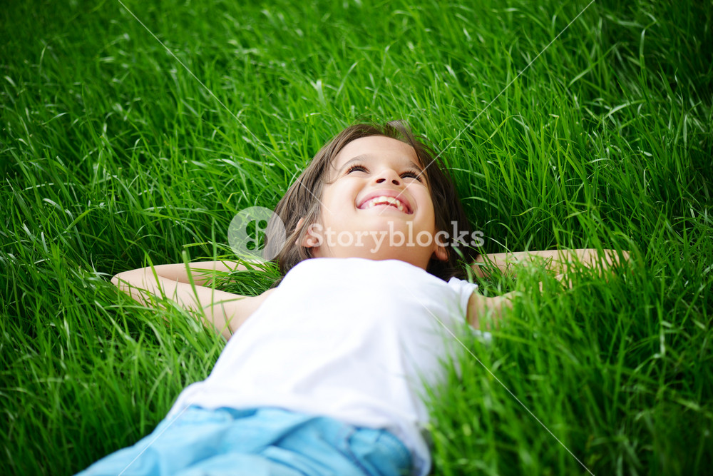 Happy child enjoying on grass field and dreaming Royalty-Free Stock ...