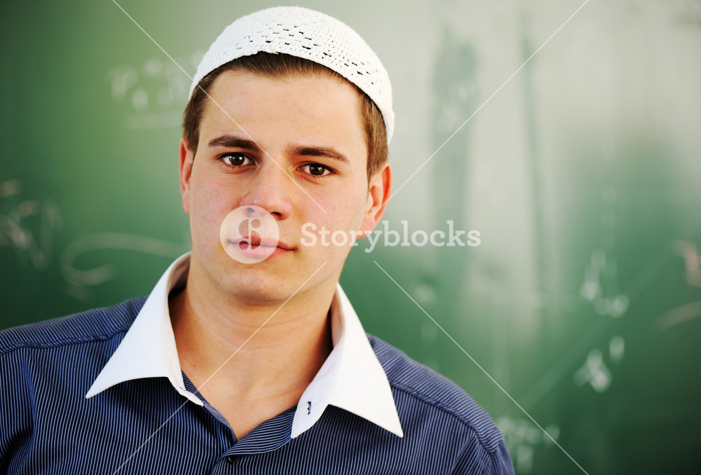 Happy students alone inside the high school classroom posing on board ...