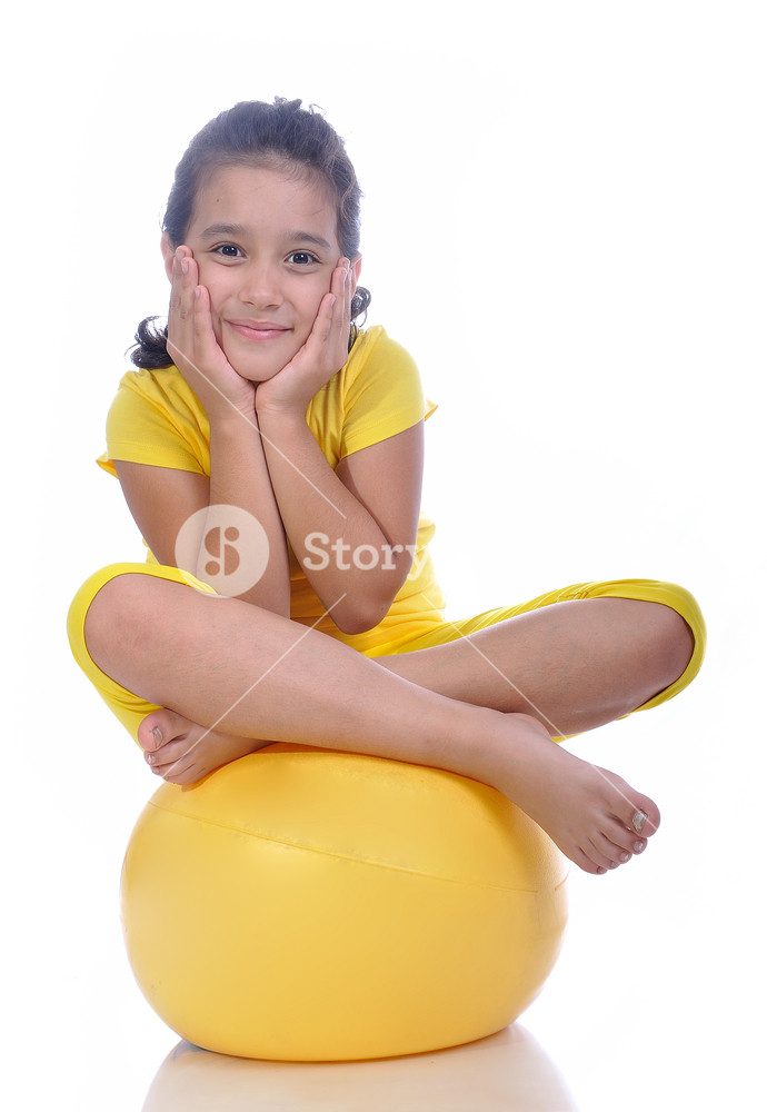 Lovely child with yellow outfit and yellow ball Royalty-Free Stock ...