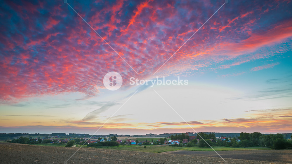 Gorgeous sunset sky over serene countryside. Polish rural landscape ...