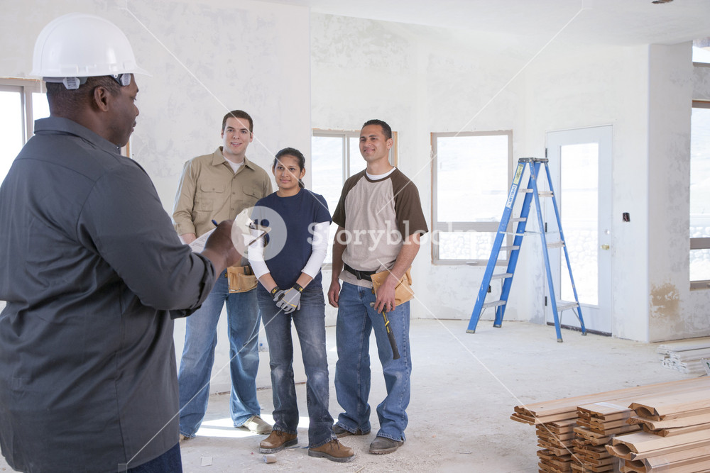 People constructing a home Royalty-Free Stock Image - Storyblocks