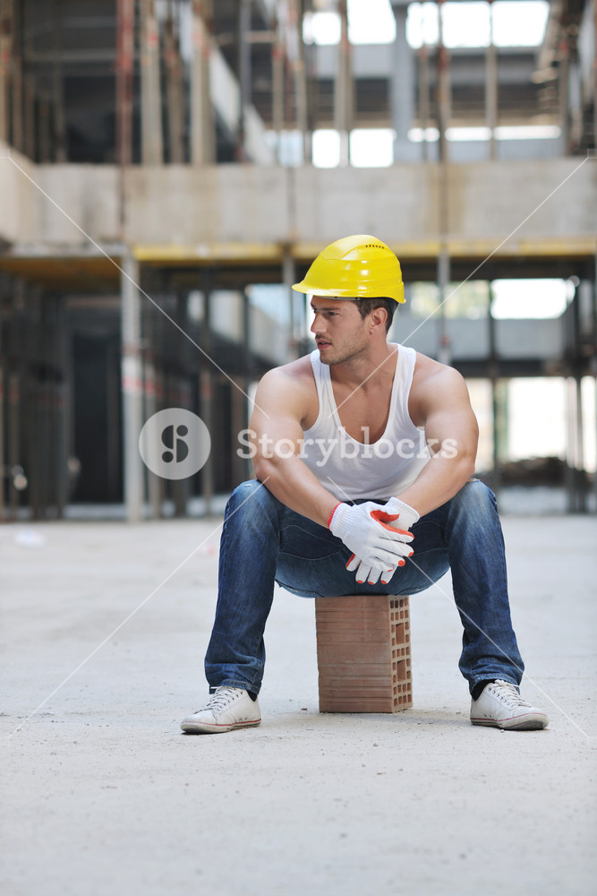 Hard Worker On Construction Site Royalty-Free Stock Image - Storyblocks