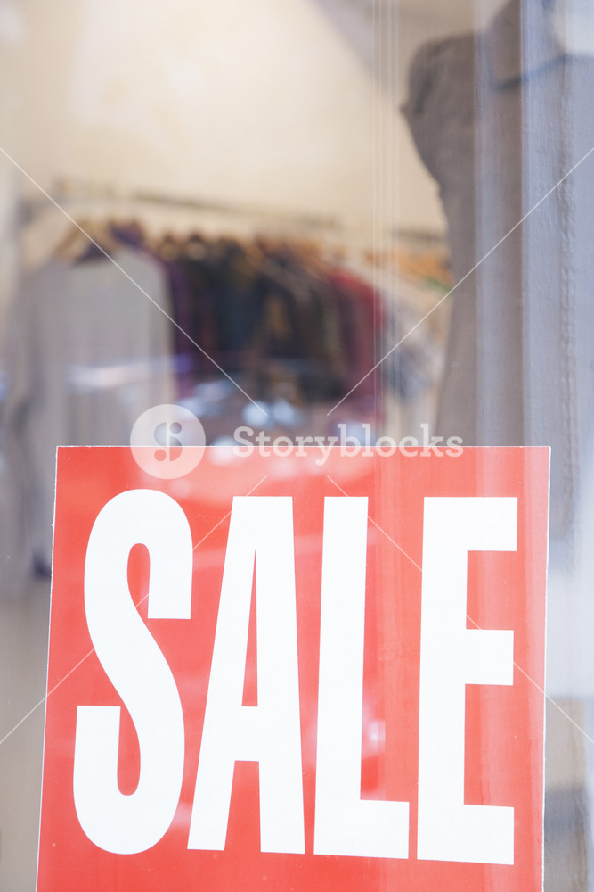 Sale sign in window Royalty-Free Stock Image - Storyblocks