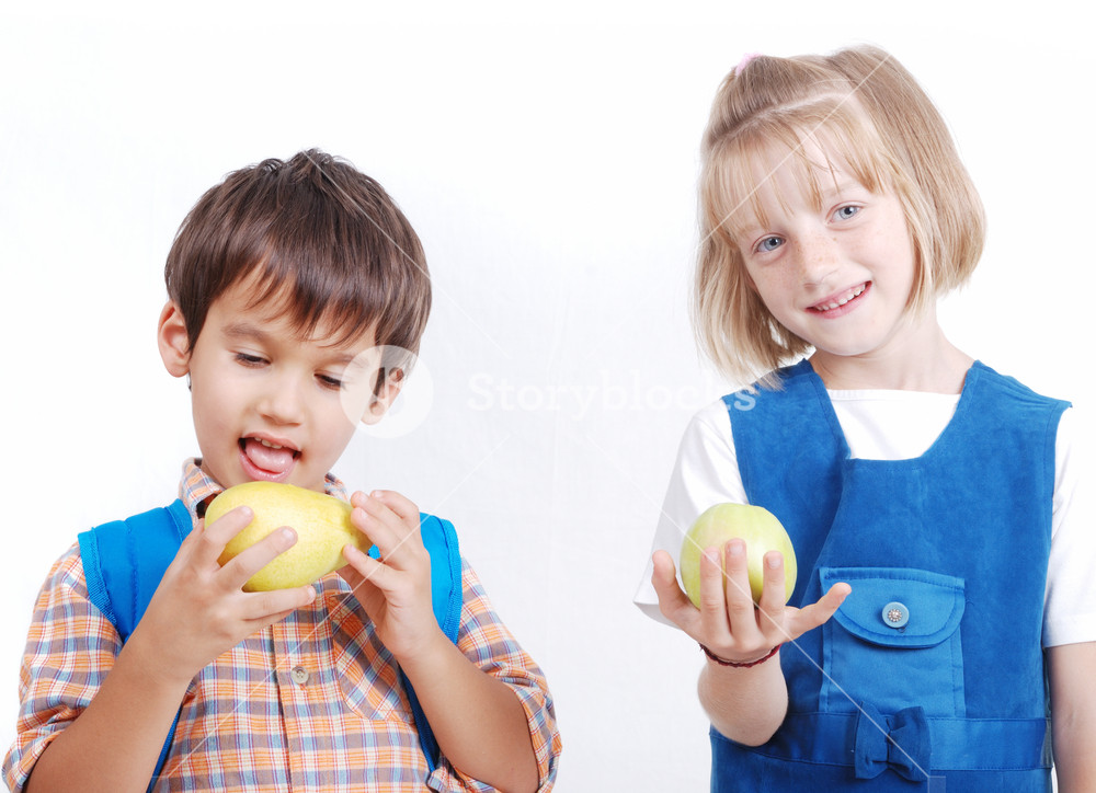 Two kids with apples Royalty-Free Stock Image - Storyblocks