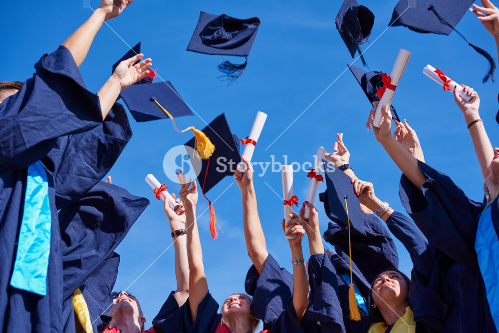 Young graduates celebrating Royalty-Free Stock Image - Storyblocks